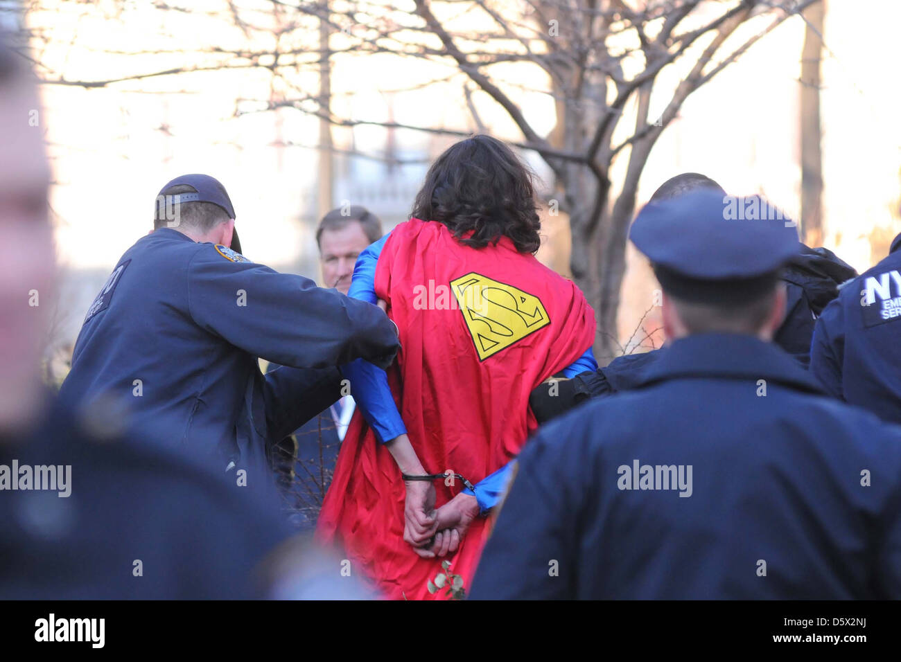 A man dressed in a Superman costume protests against social ...