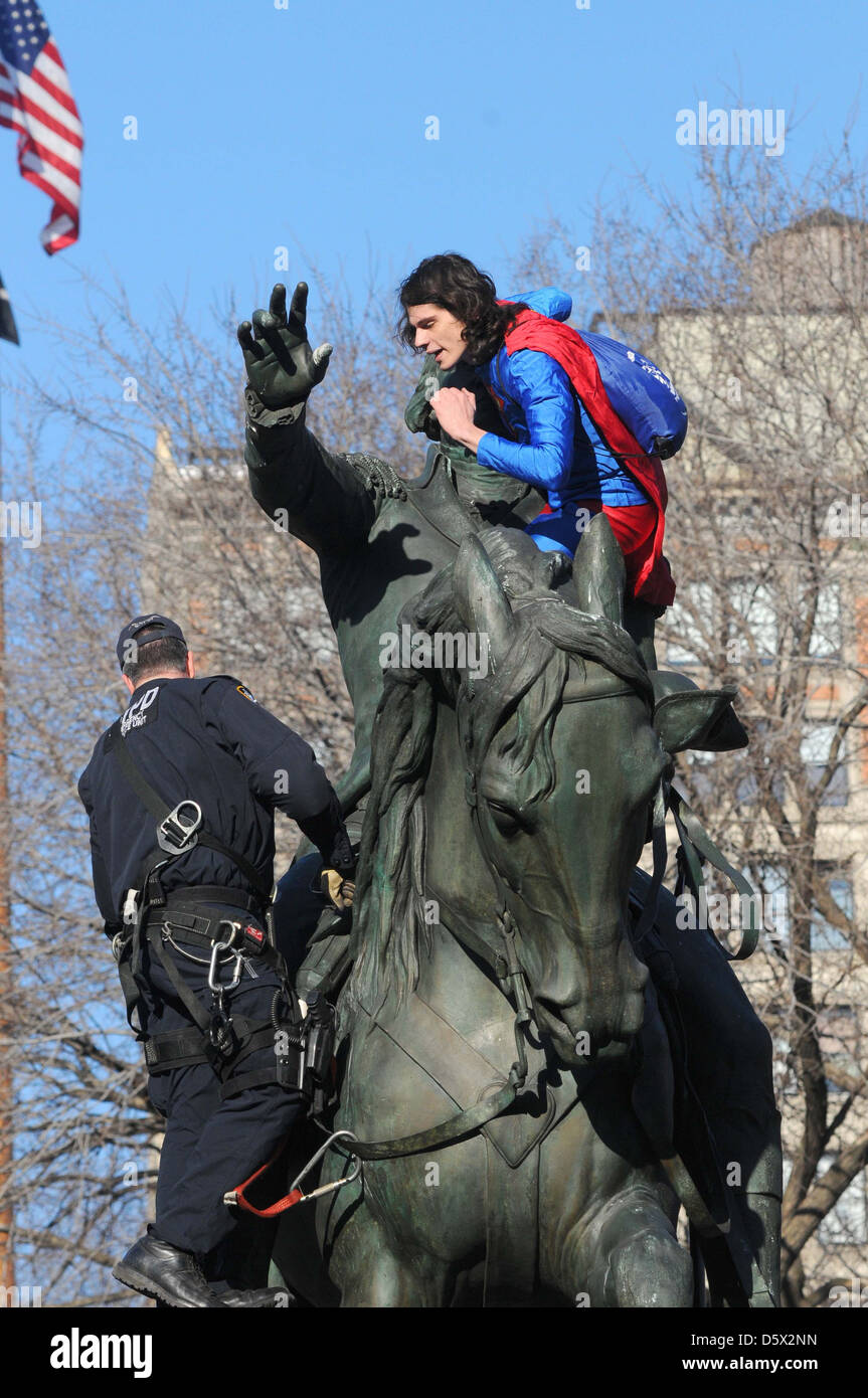 A man dressed in a Superman costume protests against social ...