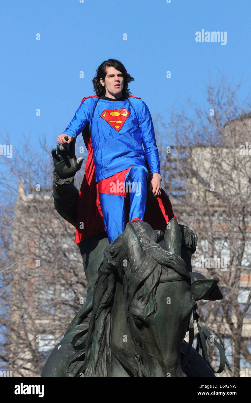 A man dressed in a Superman costume protests against social ...