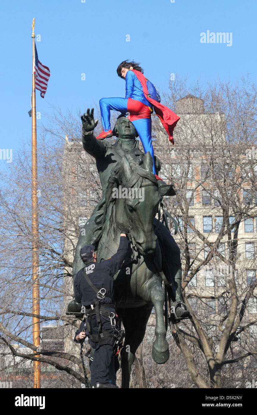 A man dressed in a Superman costume protests against social ...