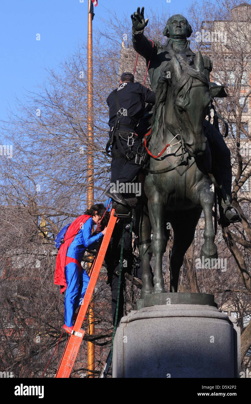 A man dressed in a Superman costume protests against social ...