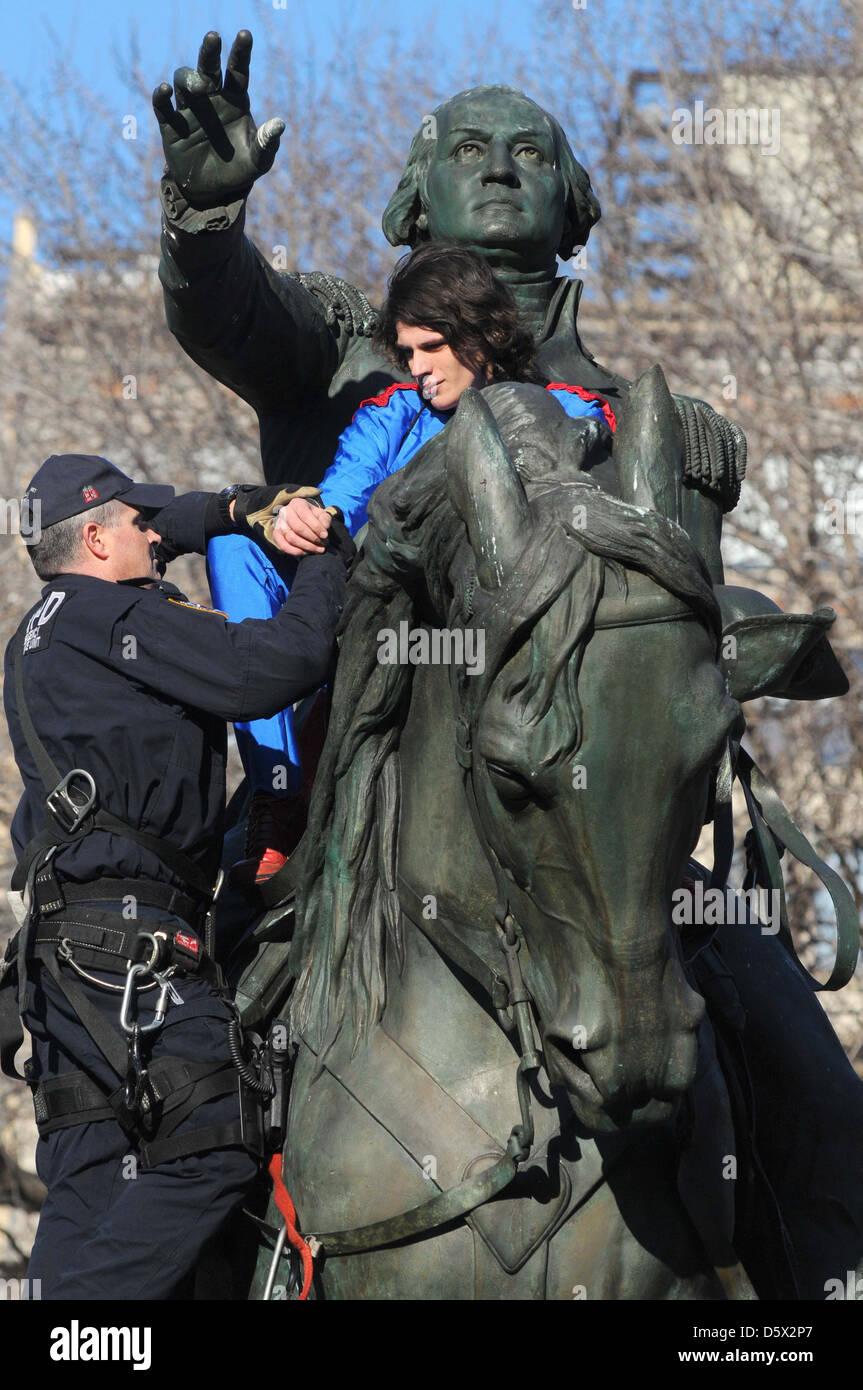 A man dressed in a Superman costume protests against social ...