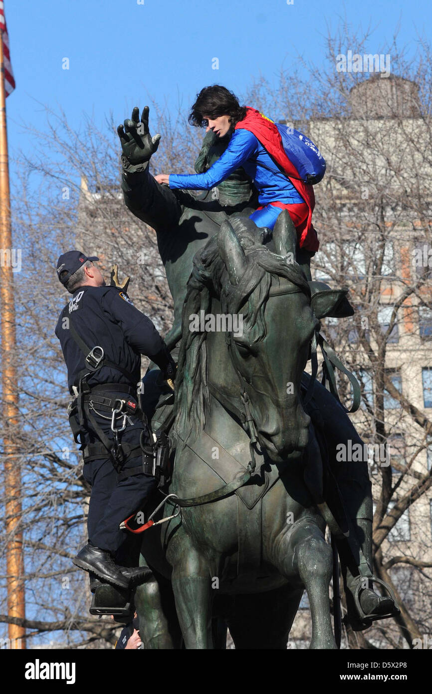 A man dressed in a Superman costume protests against social ...