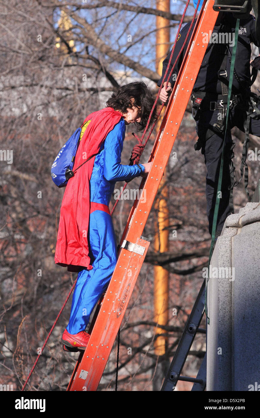 A man dressed in a Superman costume protests against social ...