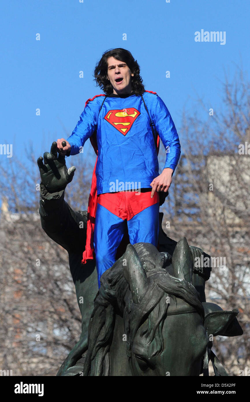 A man dressed in a Superman costume protests against social ...