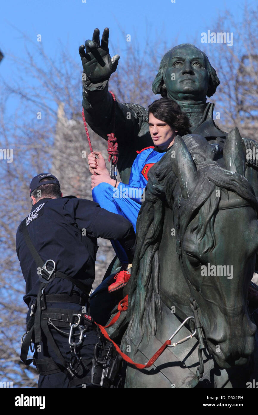 A man dressed in a Superman costume protests against social ...