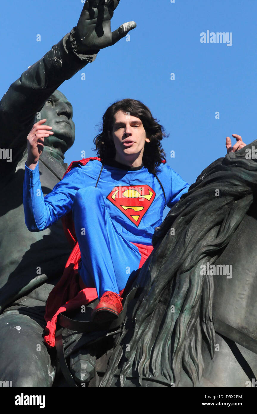 A man dressed in a Superman costume protests against social ...