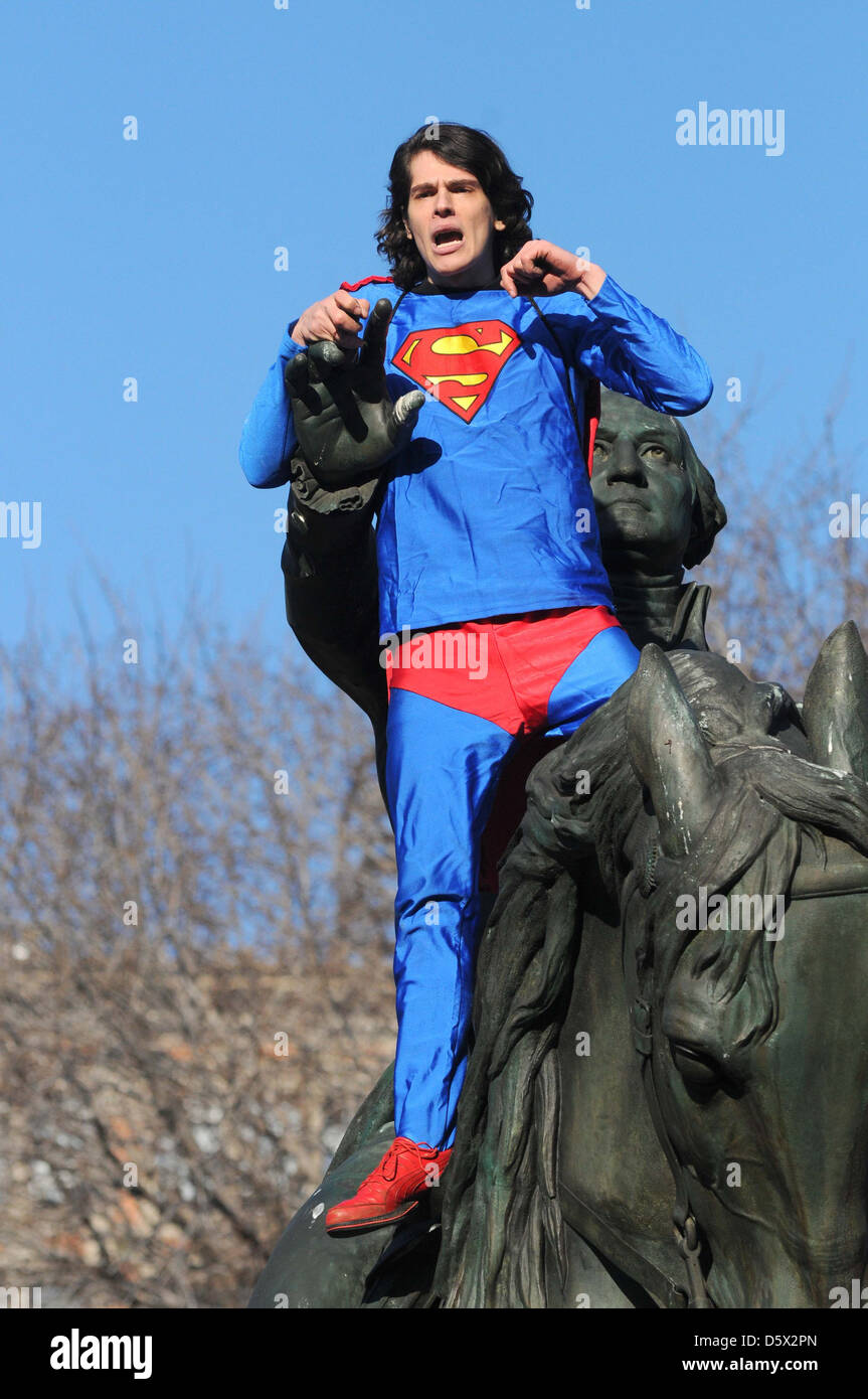A man dressed in a Superman costume protests against social ...