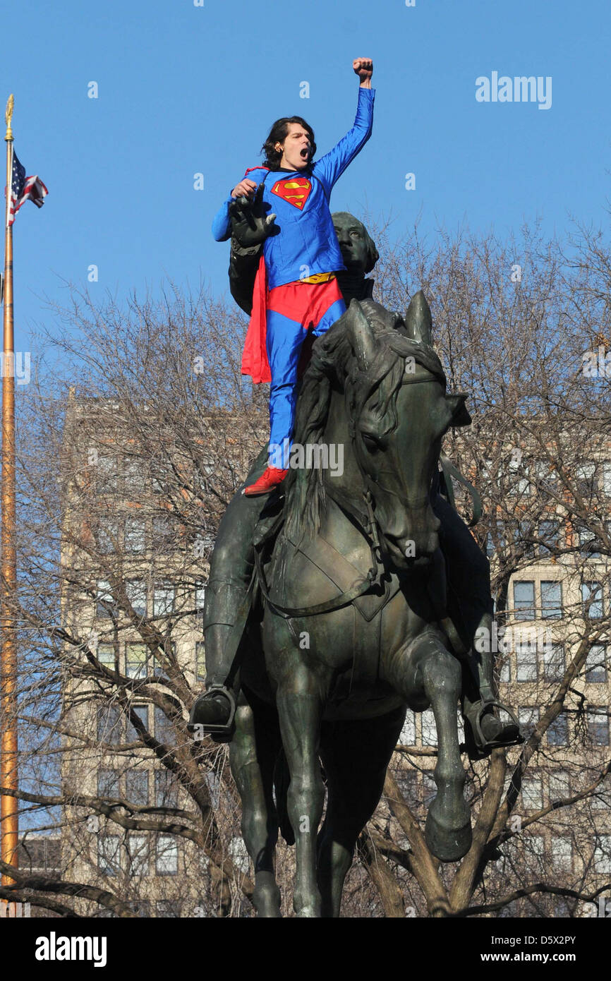 A man dressed in a Superman costume protests against social ...