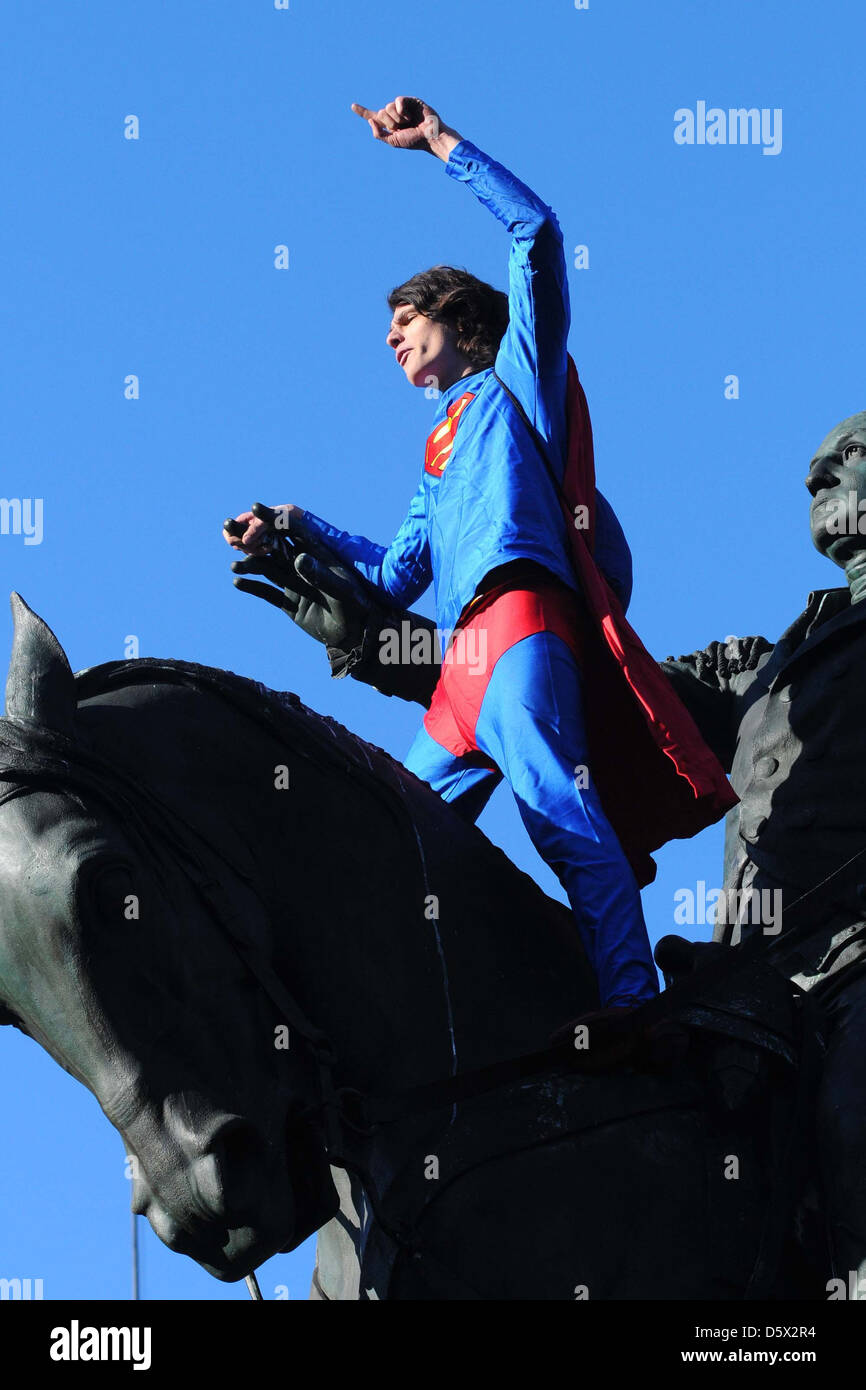 A man dressed in a Superman costume protests against social ...