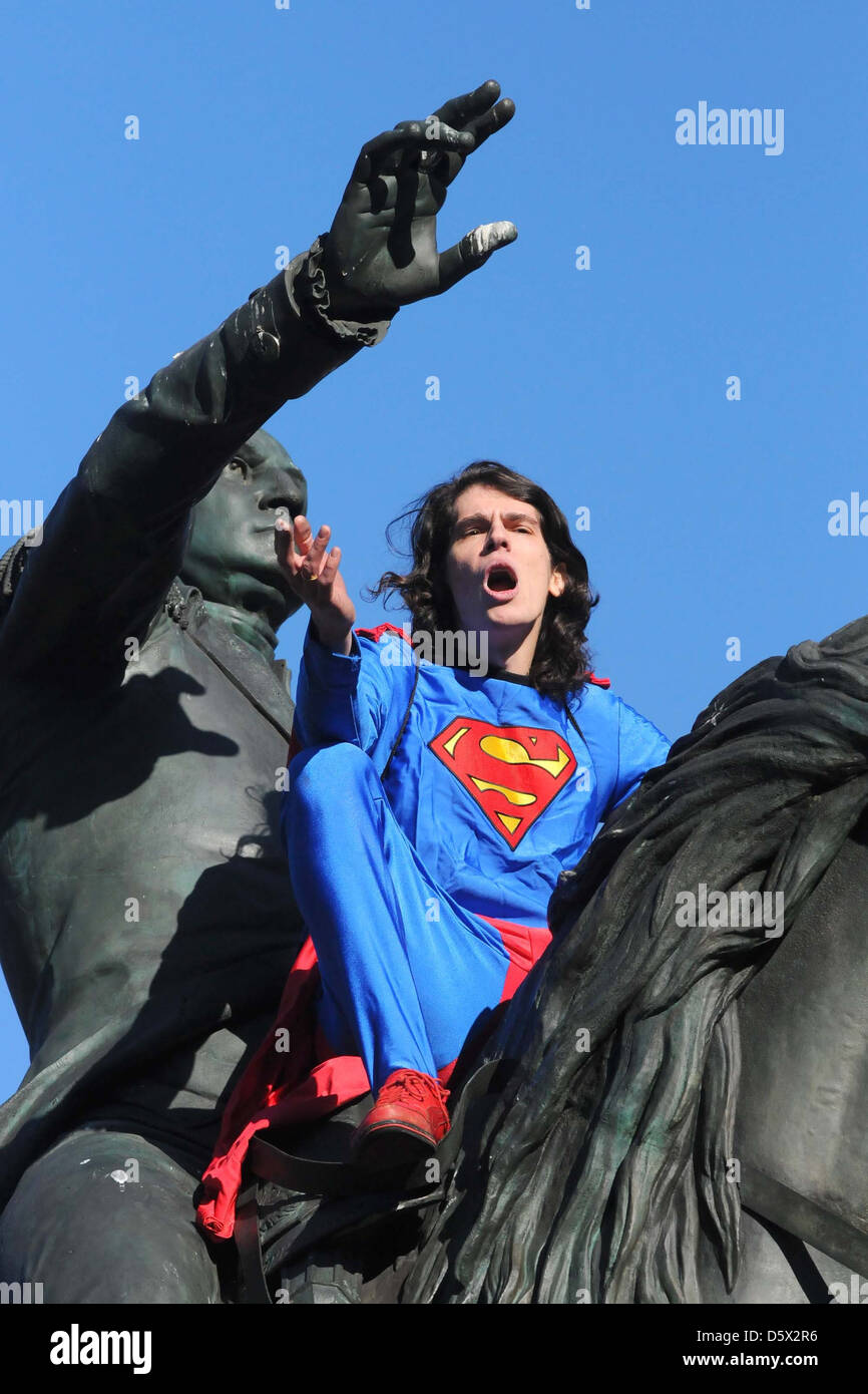 A man dressed in a Superman costume protests against social ...