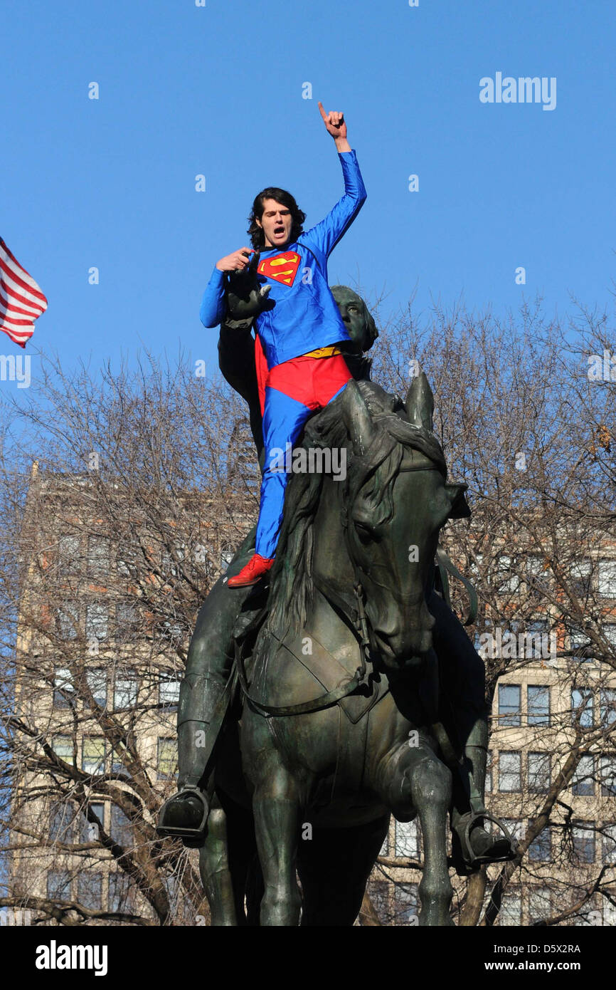 A man dressed in a Superman costume protests against social ...