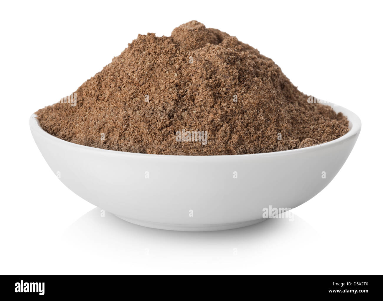 Ground pepper in plate isolated on white background Stock Photo - Alamy