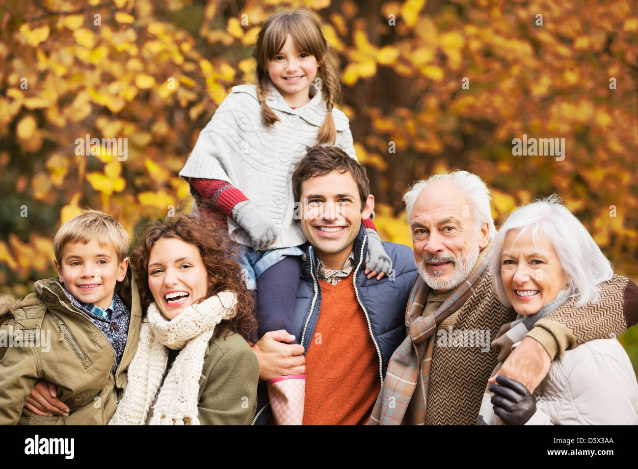 Family smiling together in park Stock Photo - Alamy