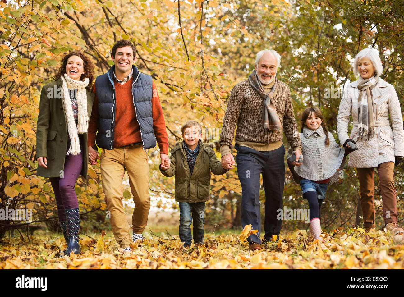 Family walking together in park Stock Photo - Alamy