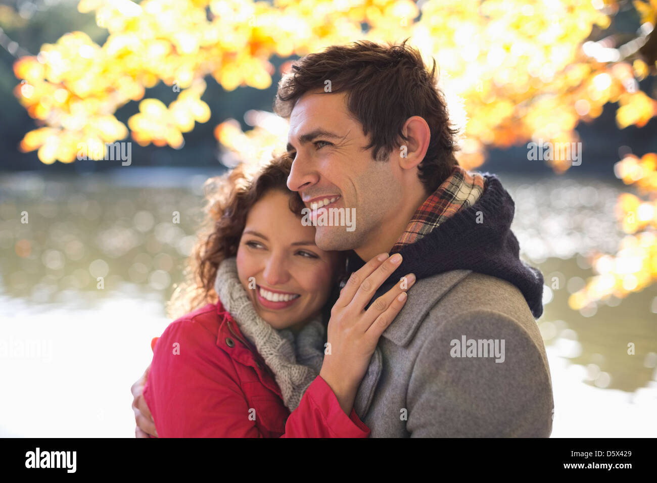 Couple smiling together in park Stock Photo - Alamy
