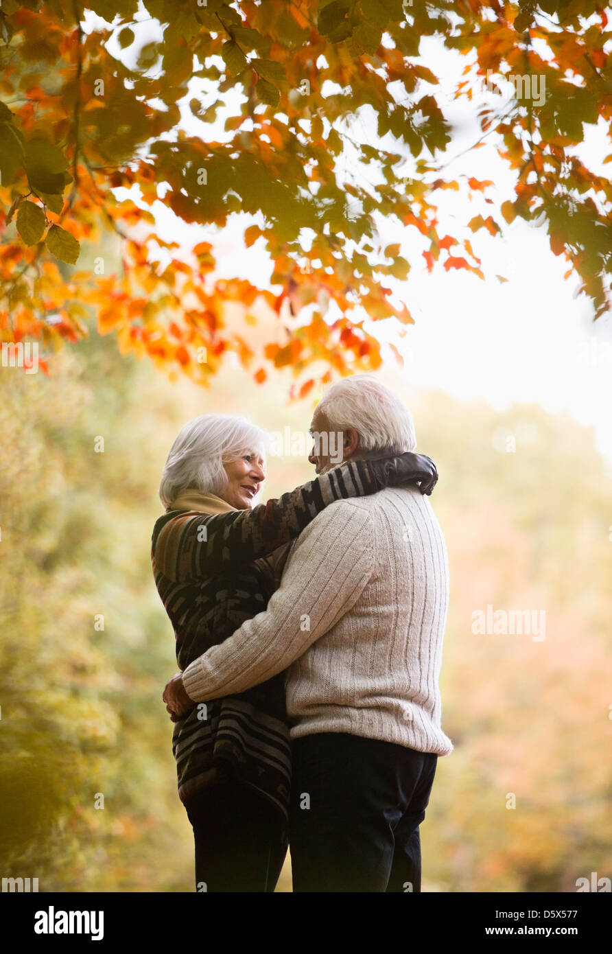 Older couple hugging in park Stock Photo - Alamy