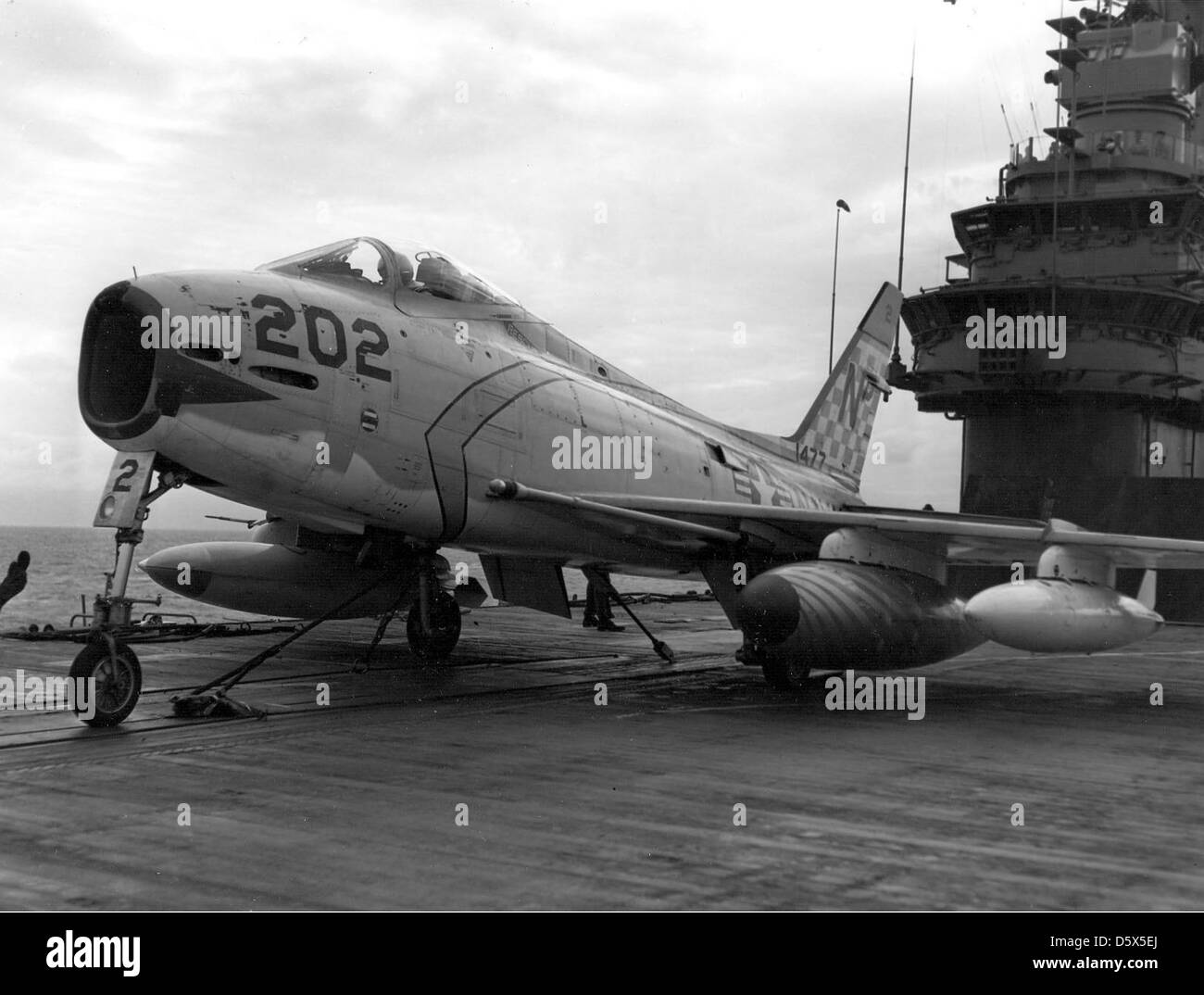North American FJ-4B (AF-1E) "Fury" of VA-212 is on the flight deck of ...