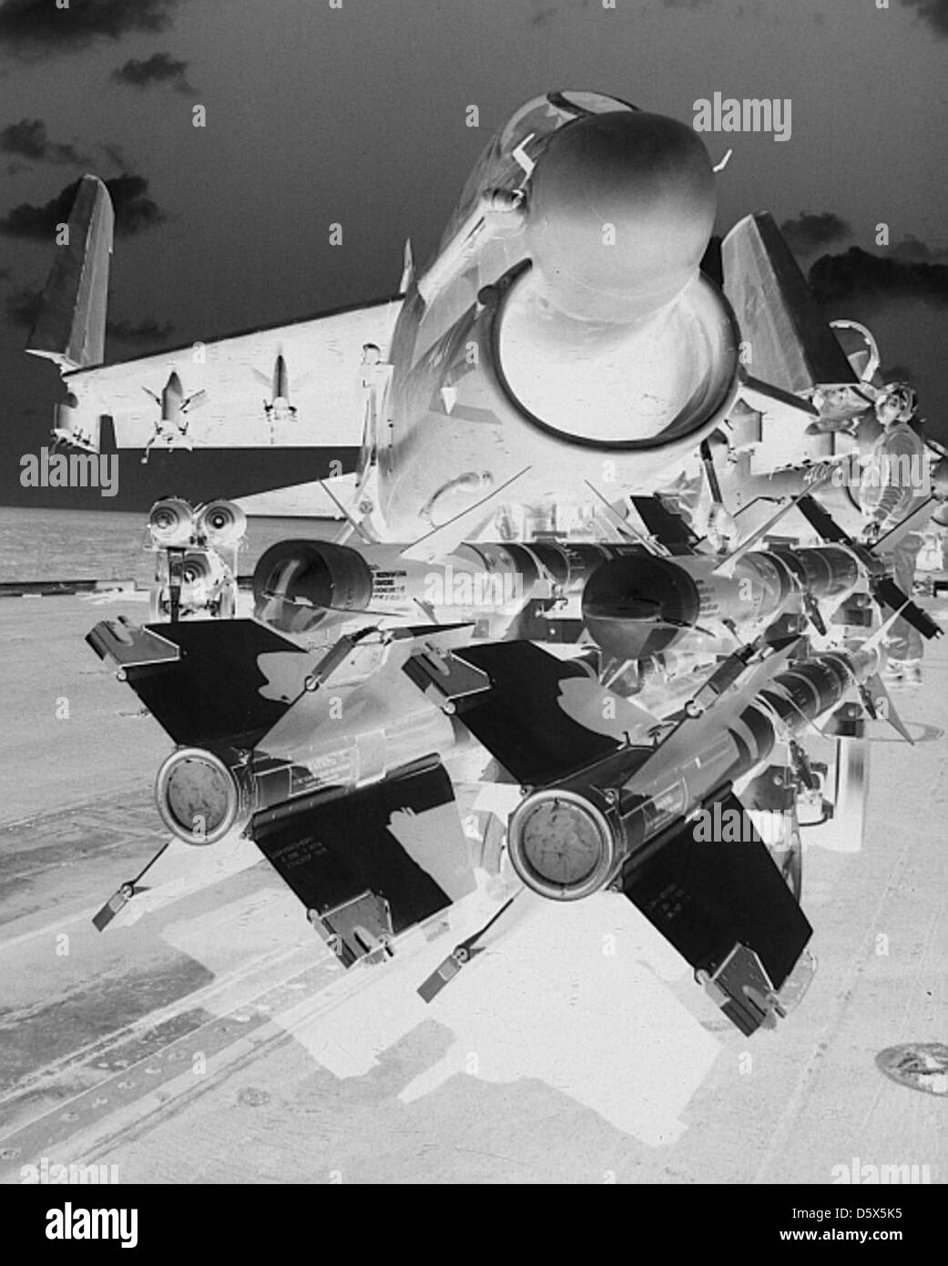 AIM-9 Sidewinder missiles on a cart ready for loading on the flight ...