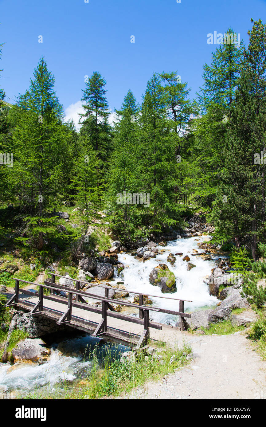Bridge on mountain river Stock Photo - Alamy