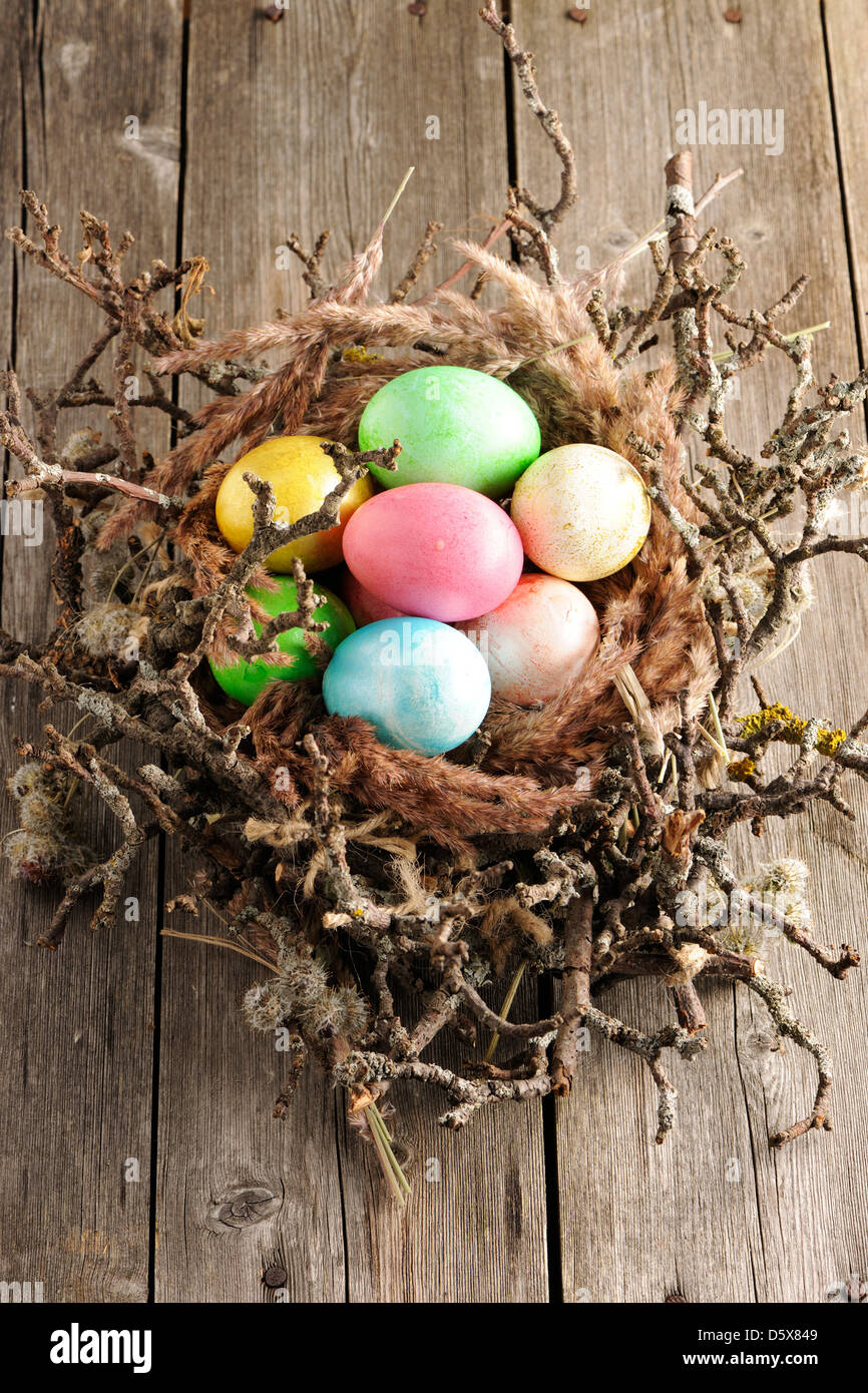Colored easter eggs in nest Stock Photo - Alamy