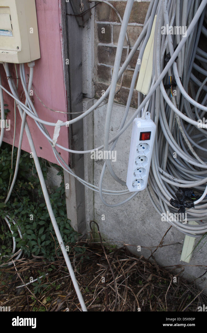 power socket and cable hanging outdoors Stock Photo - Alamy