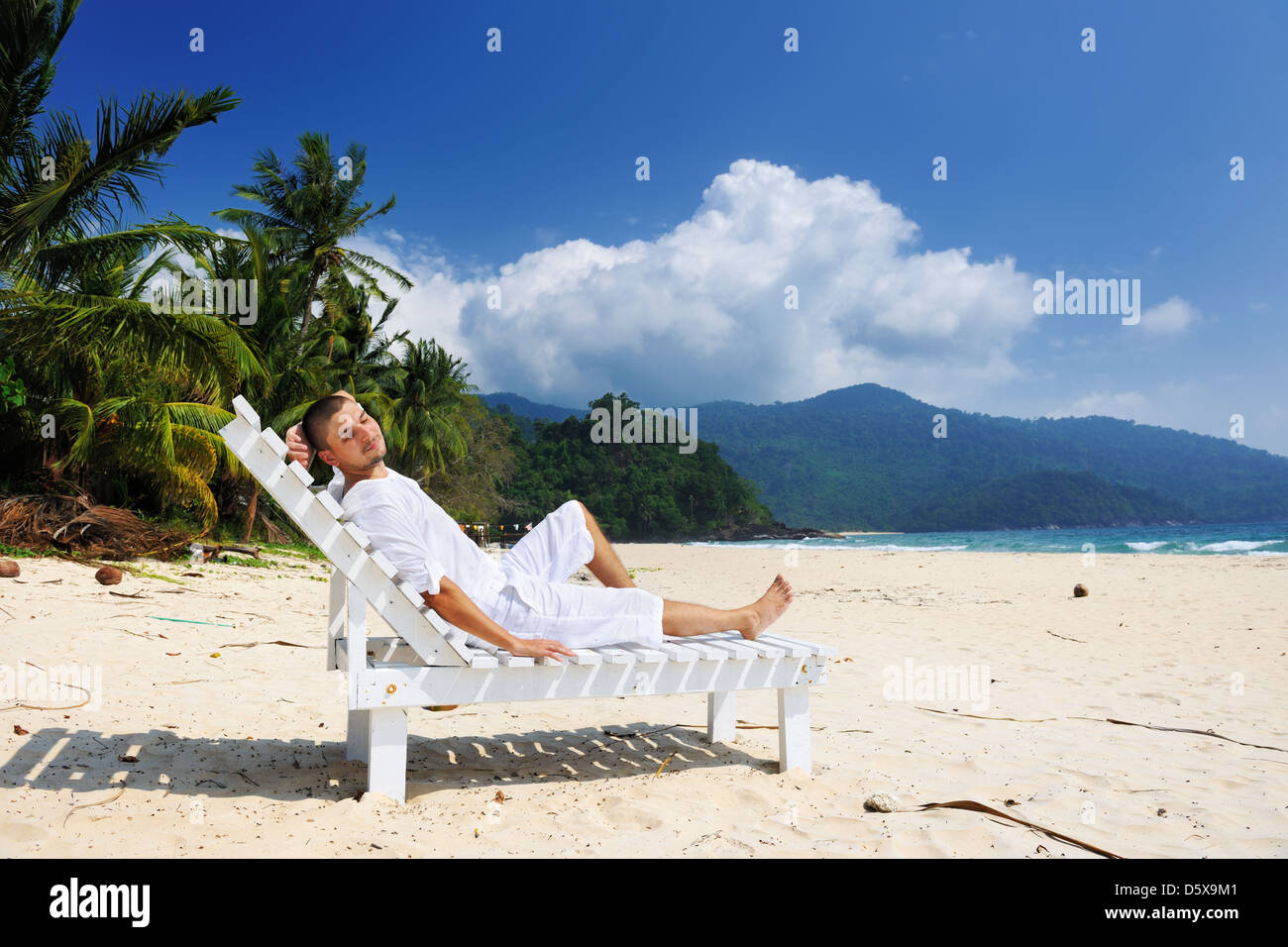 Man relaxing on a beach Stock Photo - Alamy