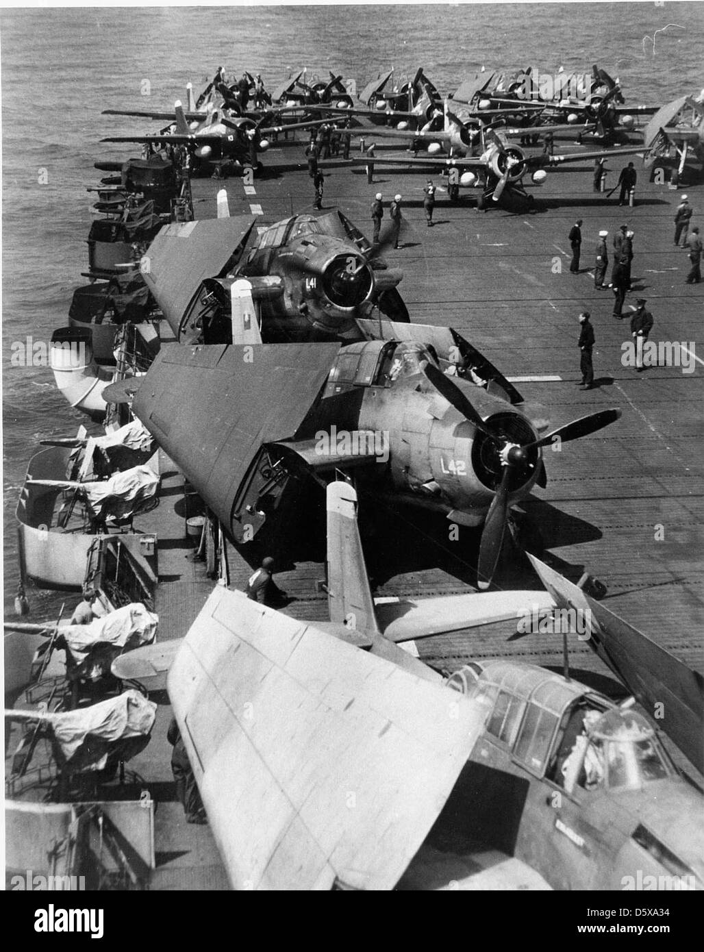 Grumman TBM Avengers of Composite Squadron 9 are shown on the flight ...