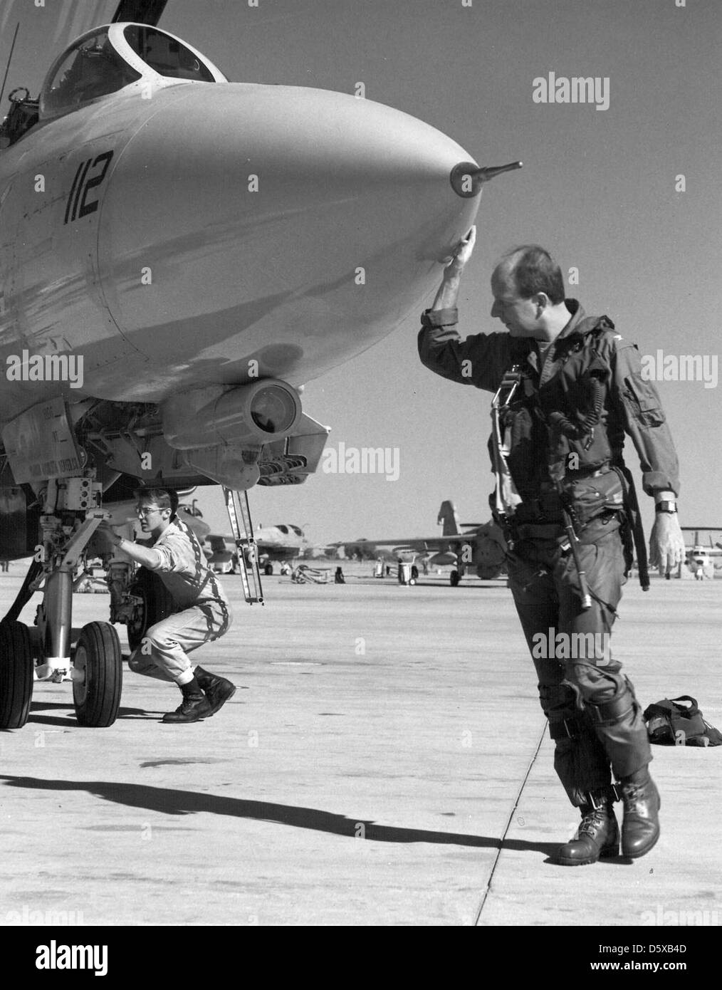 Captain W.S. 'Bud' Orr, commander of Carrier Air Wing 14, conducts a ...