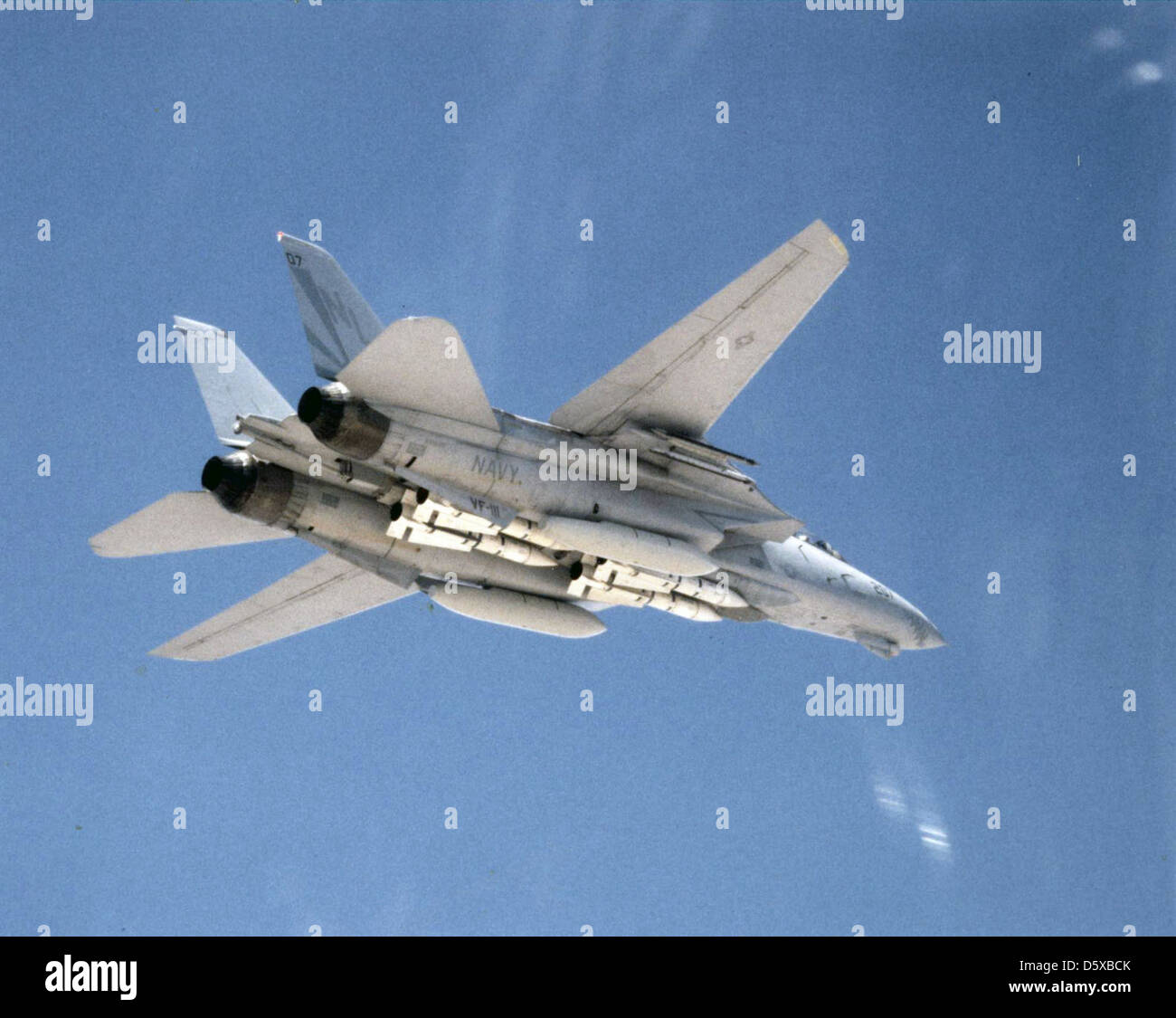 This underside view of a Grumman F-14 Tomcat from Fighter Squadron 111 ...