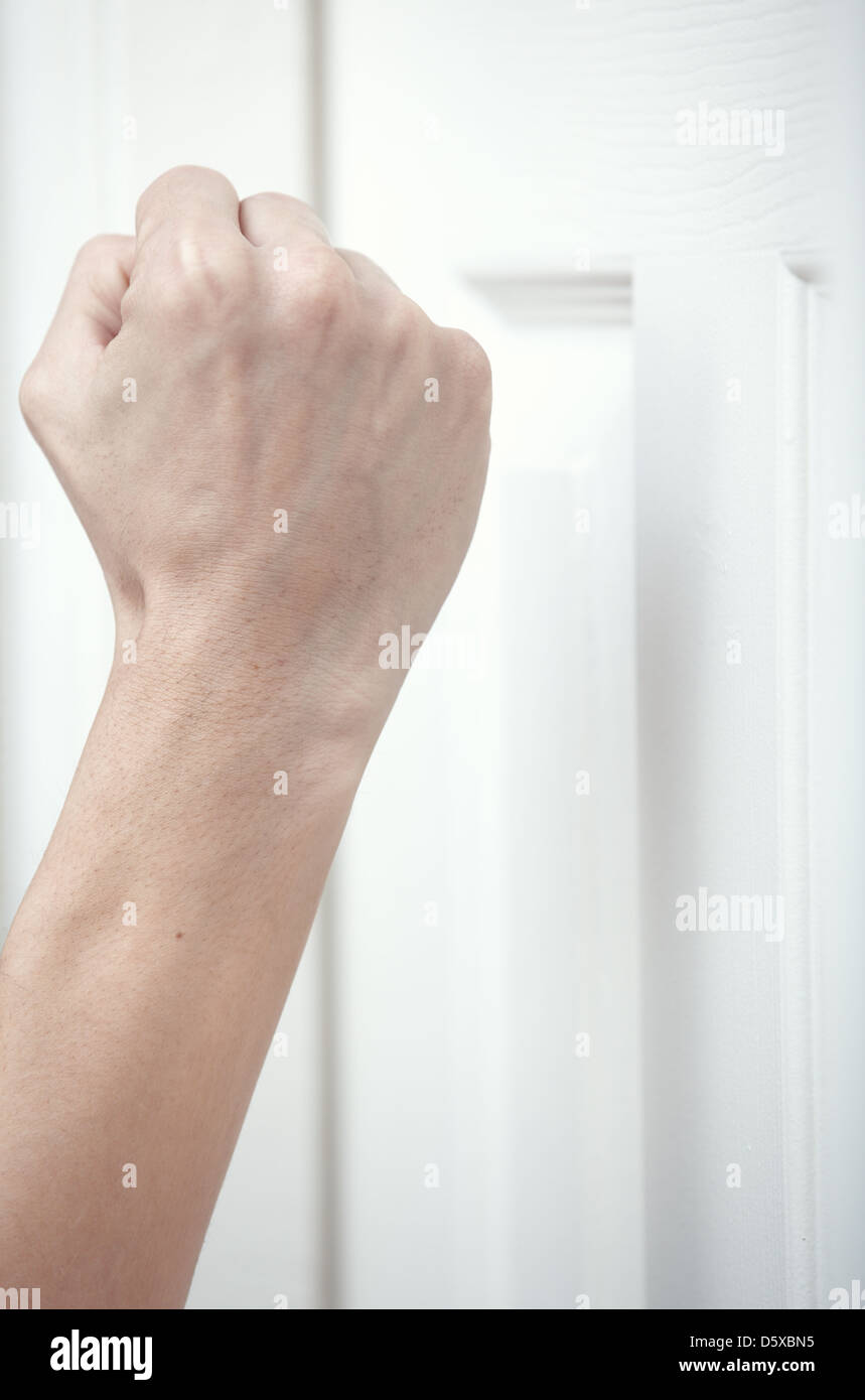 Door knock fist hi-res stock photography and images - Alamy