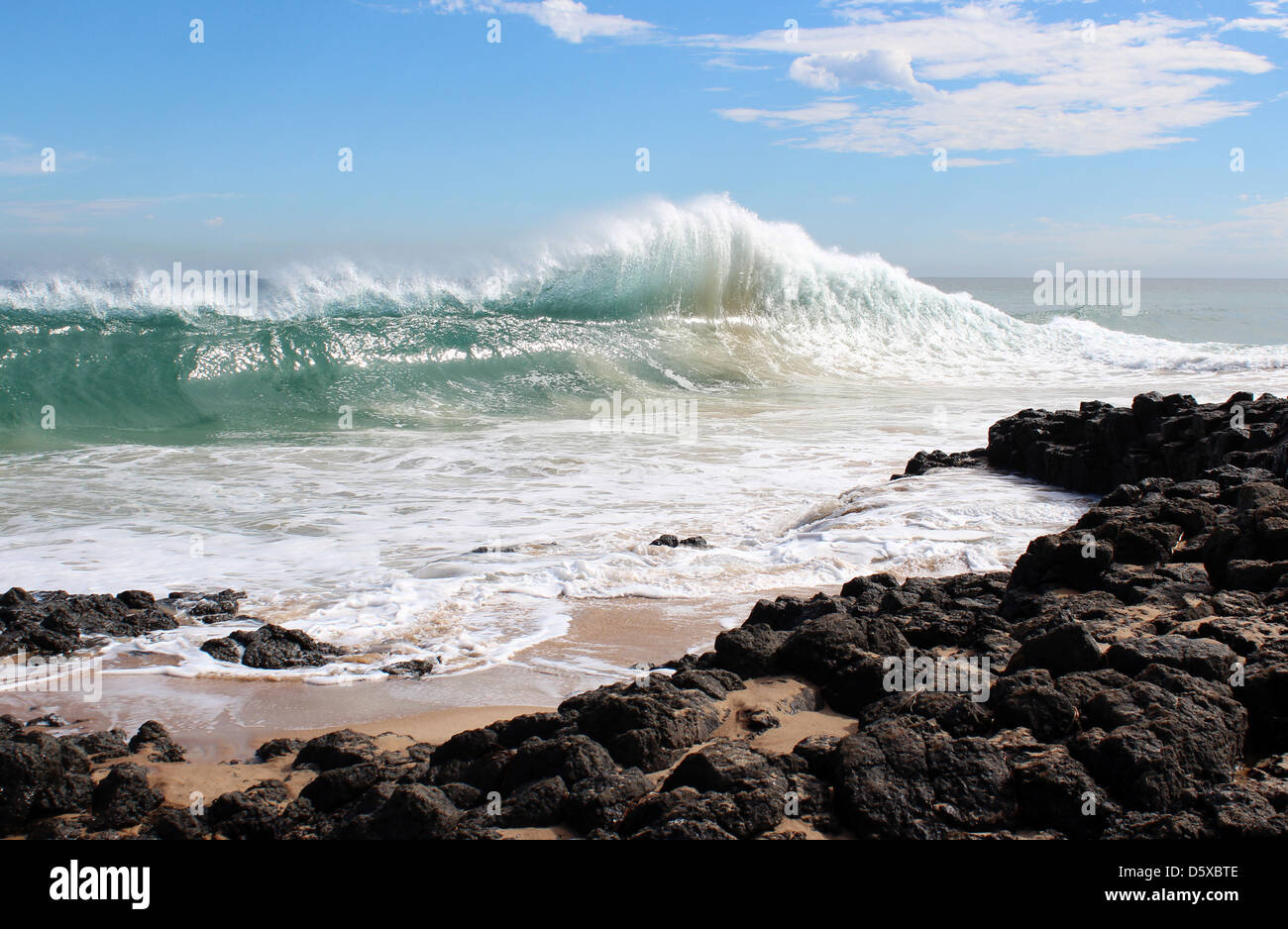 Splashing, foaming white backwash from the Indian Ocean waves breaking ...