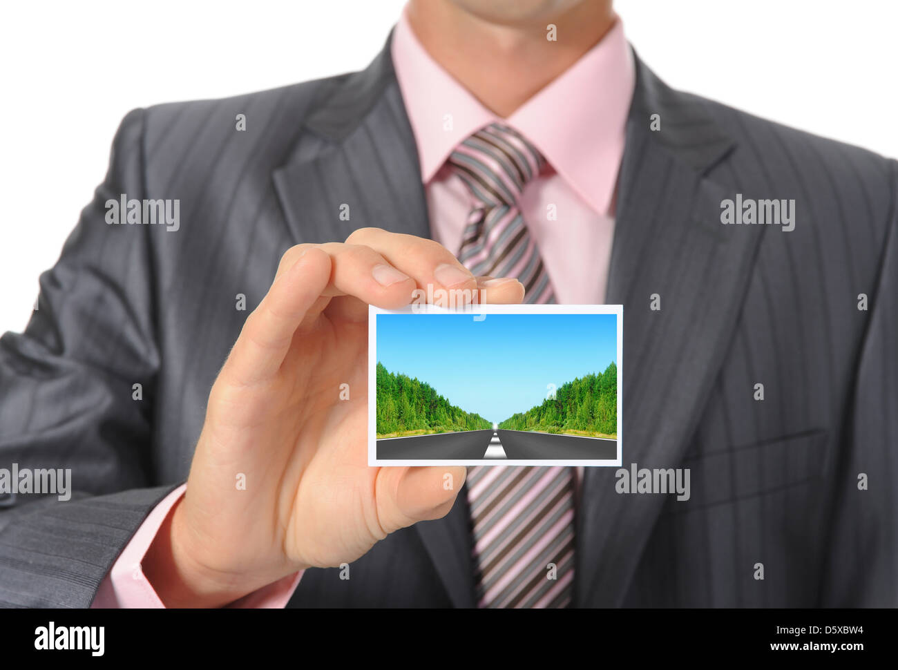 Businessman handing a card Stock Photo - Alamy