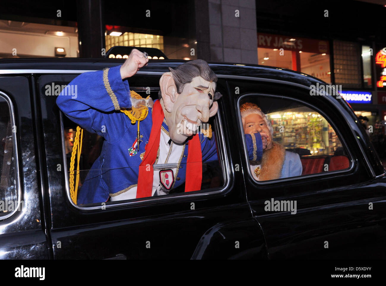 Masked royal look-a-likes posing as Prince Charles and Queen Elizabeth ...