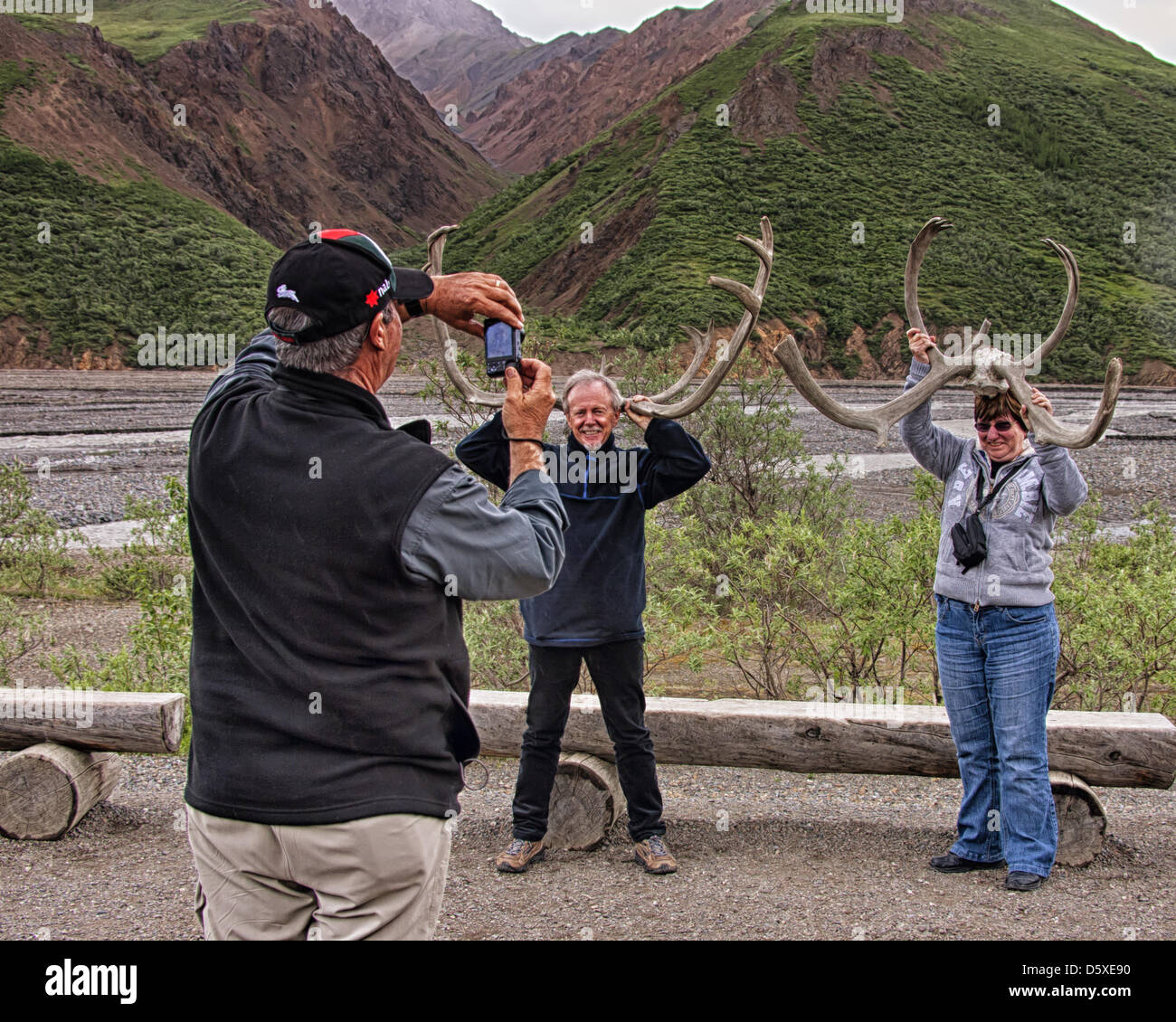 June 27, 2012 - Denali Borough, Alaska, US - Tourists pose with caribou ...