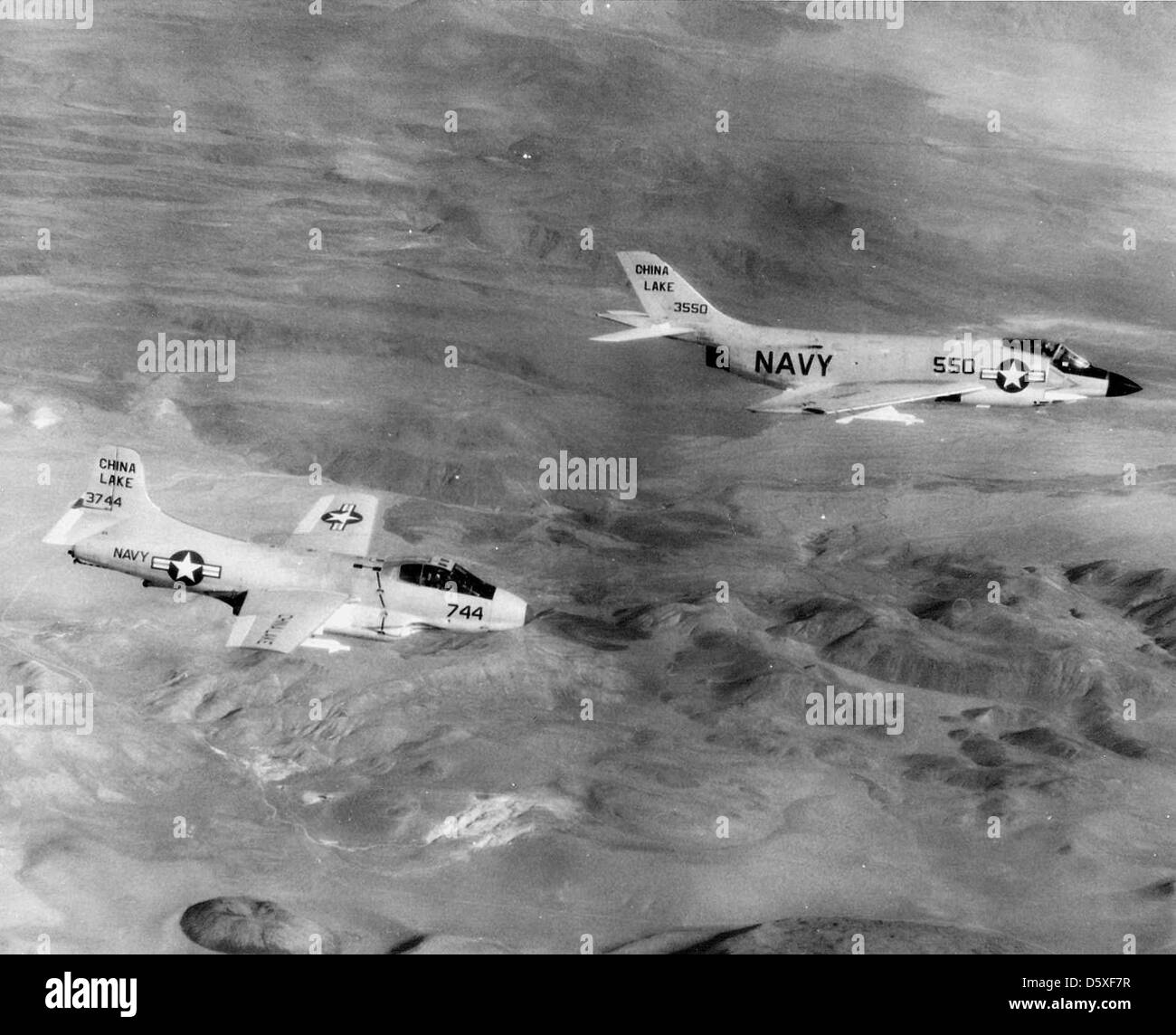 A Douglas F3D-1 "Skyknight" and a McDonnell F3H-2N "Demon" each loaded ...