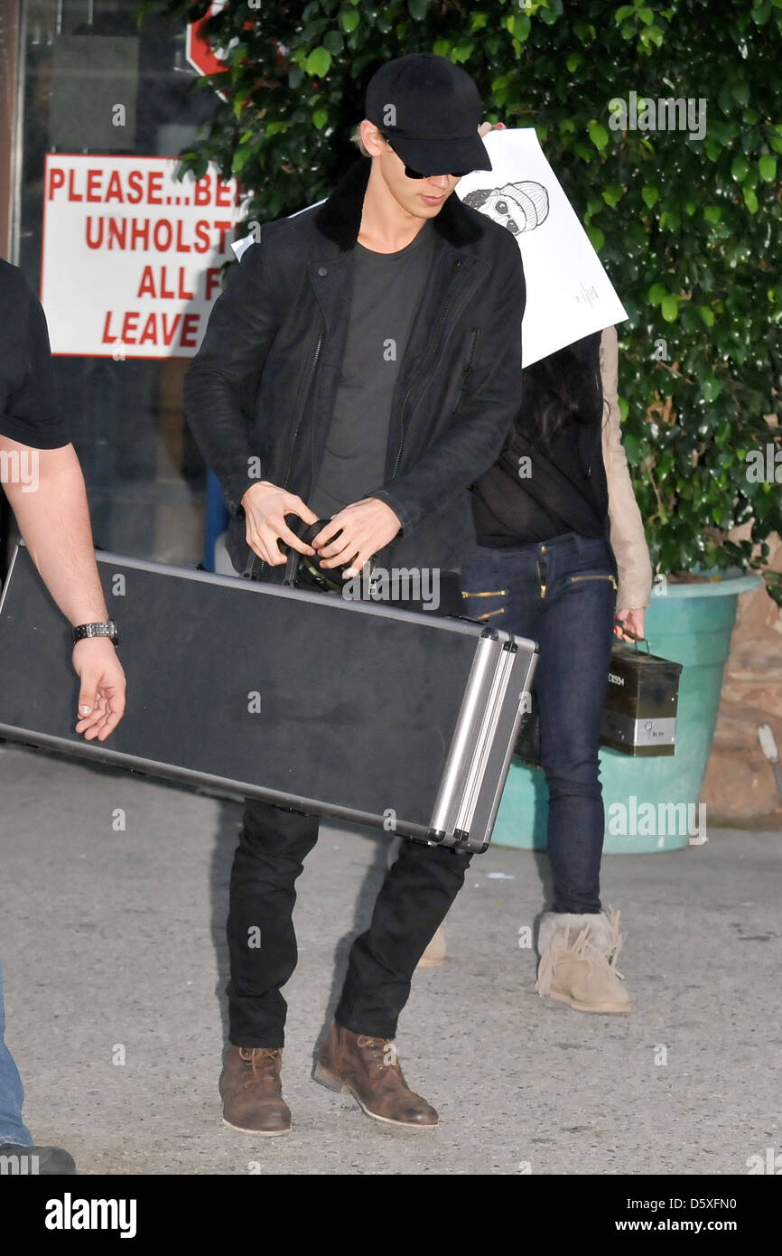 Austin Butler exits a gun range along with his girlfriend Van Nuys ...