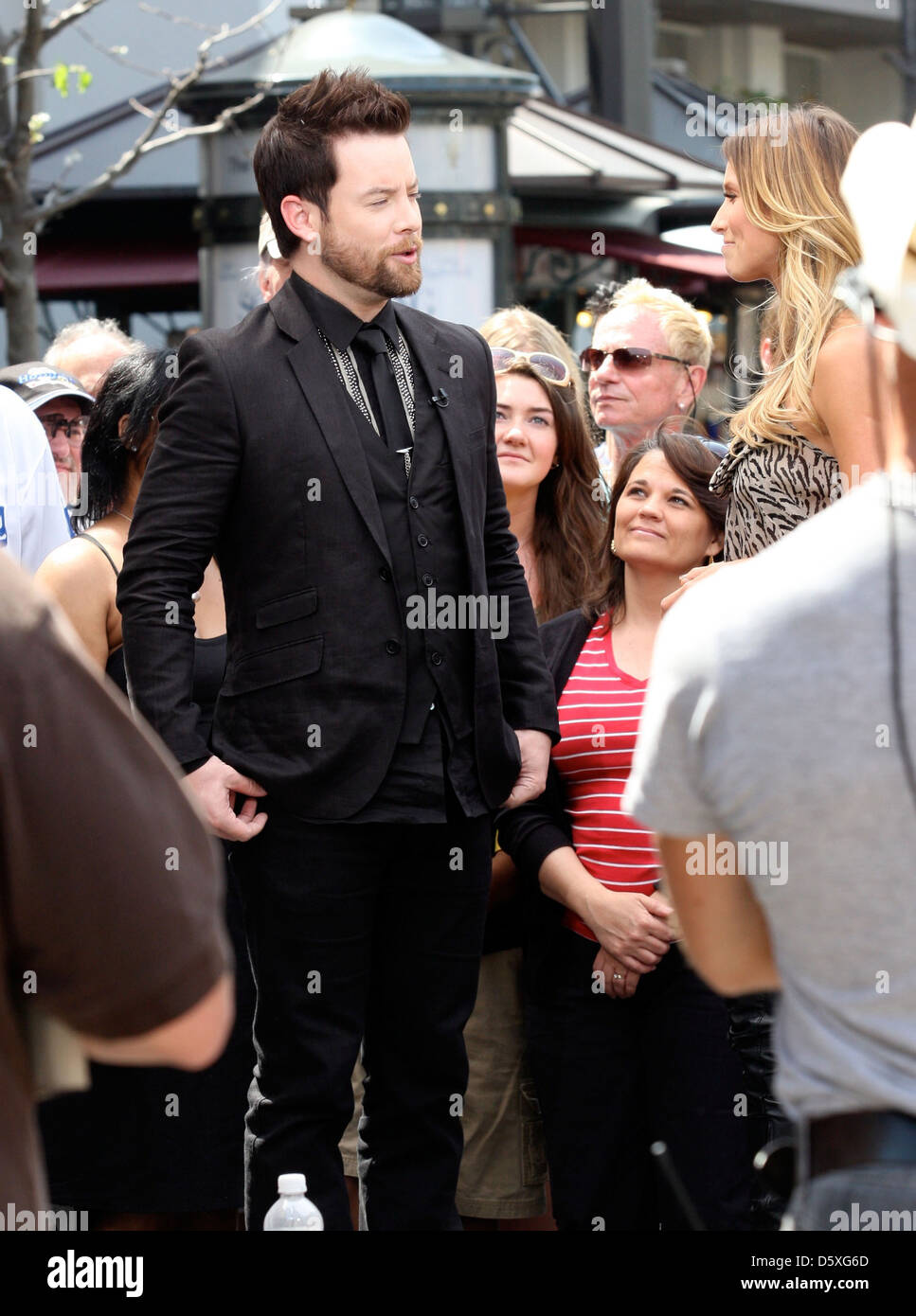 David Cook filming an interview the entertainment television news ...