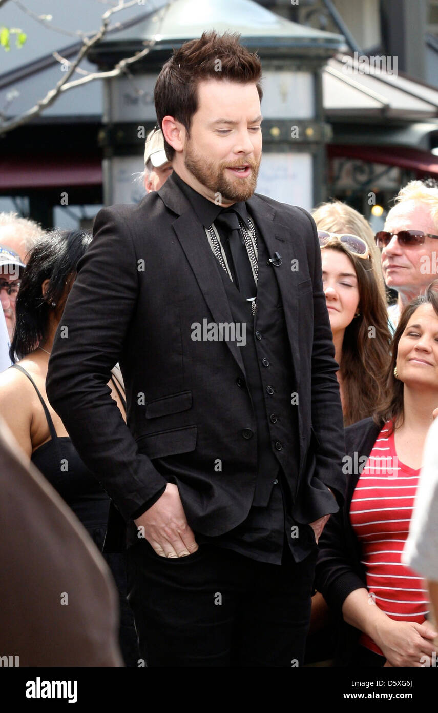 David Cook filming an interview for the entertainment television news ...