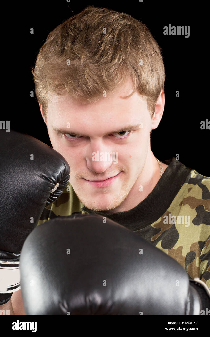 grinning young man in boxing gloves Stock Photo - Alamy