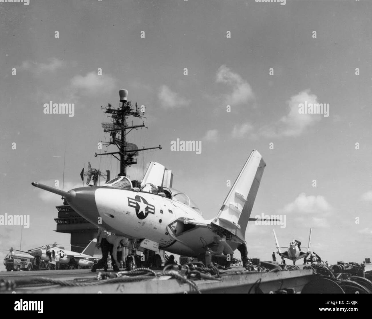 Grumman F9F-8T "Cougar" positioned on the catapult for launch Stock ...