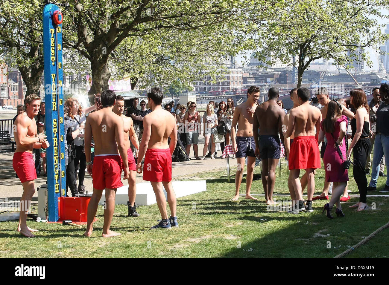Cast members of 'The Hunks' ITV filming various challenges outside with ...