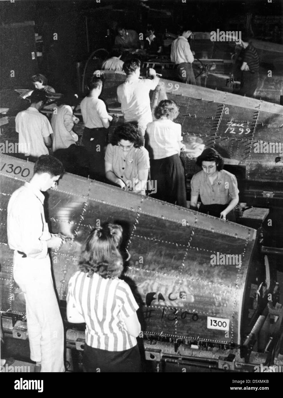 Workers assemble the fuselage of the Republic P-47 Thunderbolt, one of ...