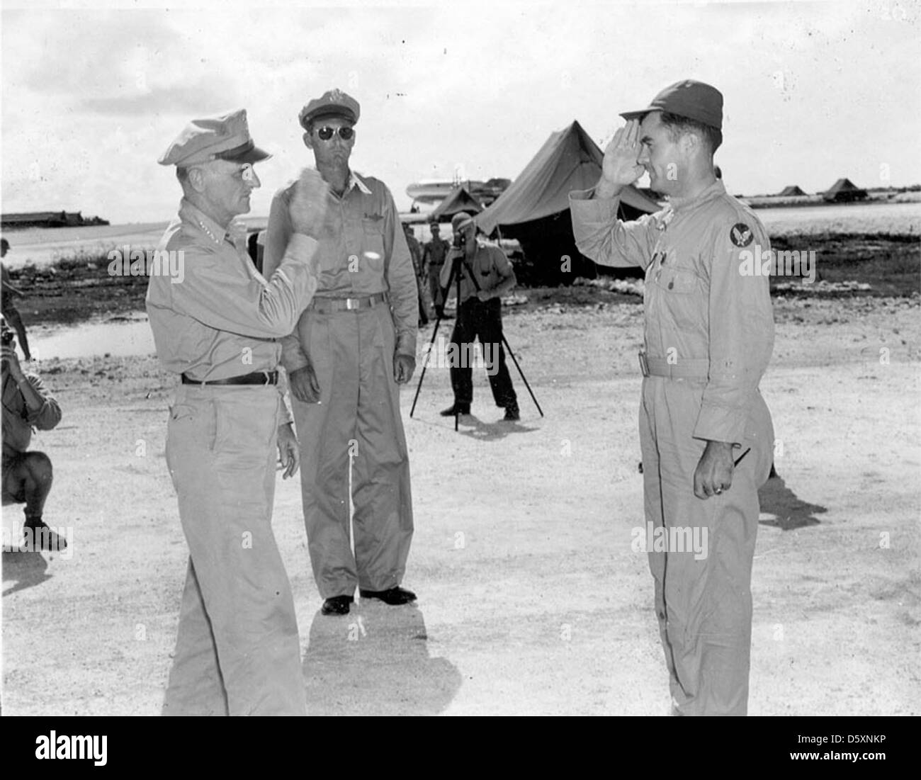 General Davies observes Colonel Tibbets receiving the Distinguished ...