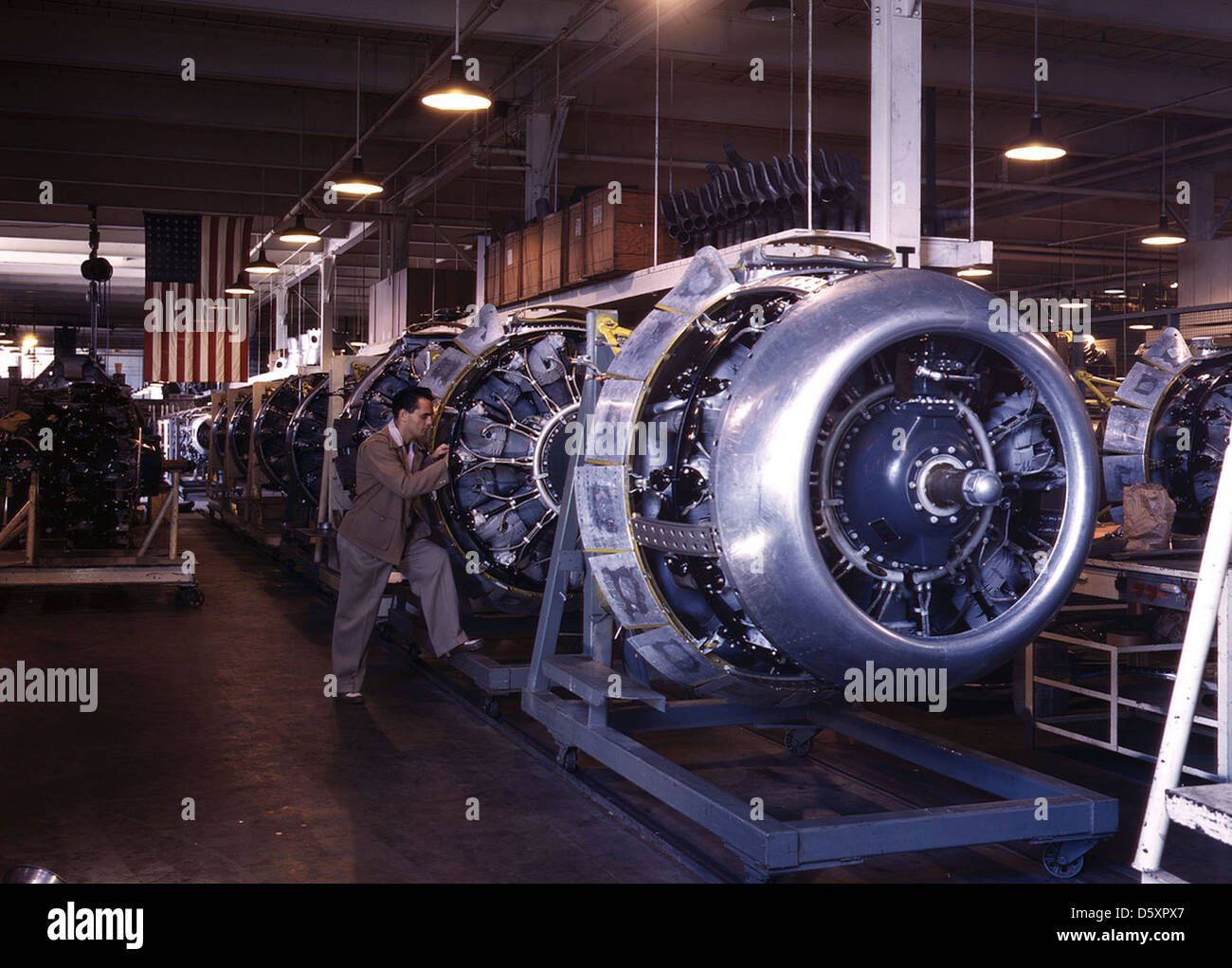 Cowling and control rods are added to motors for North American B-25 ...