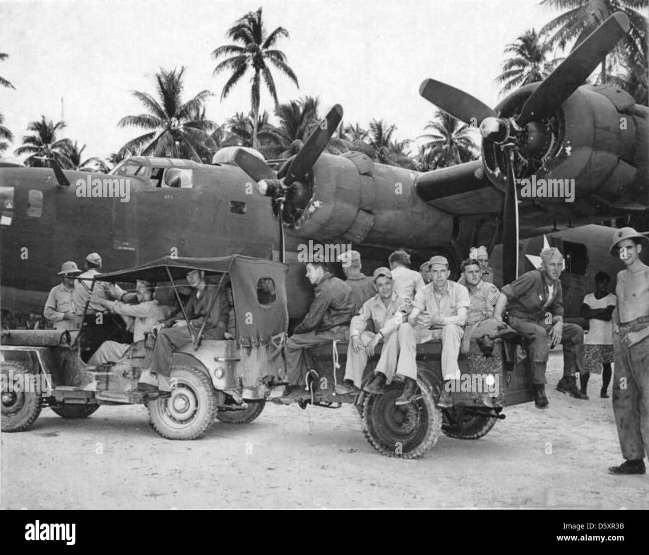 A Consolidated B-24 Liberator bomber and its crew from the U.S. 7th Air ...