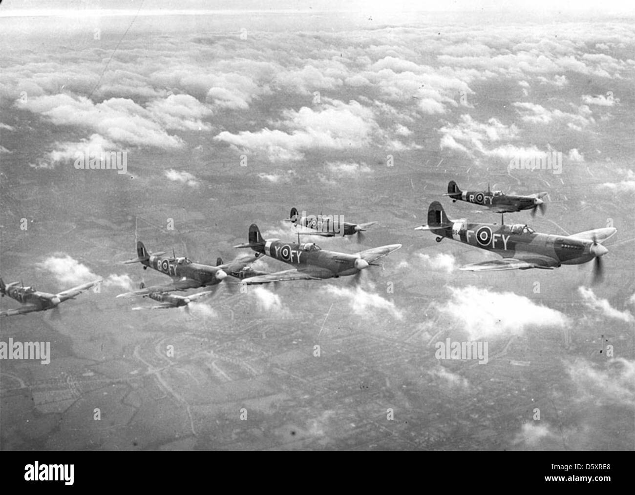 A flight of British Spitfires, iconic World War II-era fighter aircraft ...