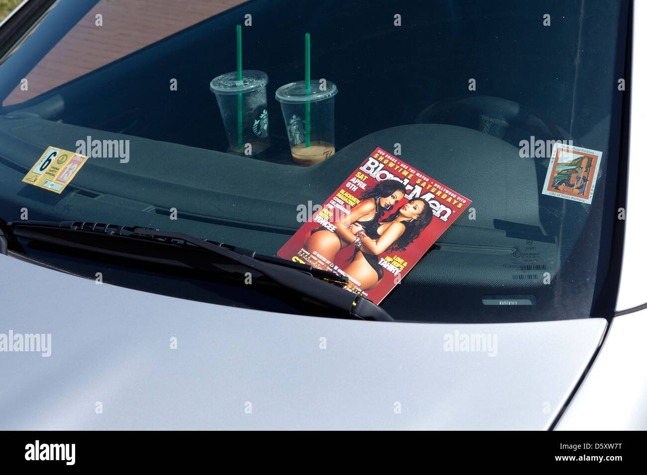 Adult entertainment ad on car windshield Stock Photo - Alamy