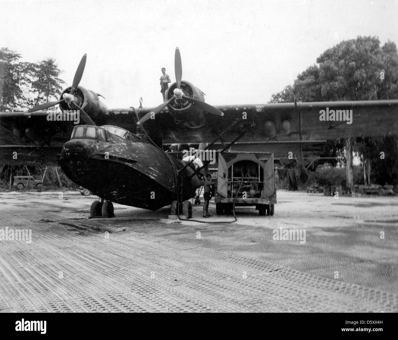 Fueling a Consolidated PBY-5 "Catalina" of VP-3 at Samarai Island Stock ...
