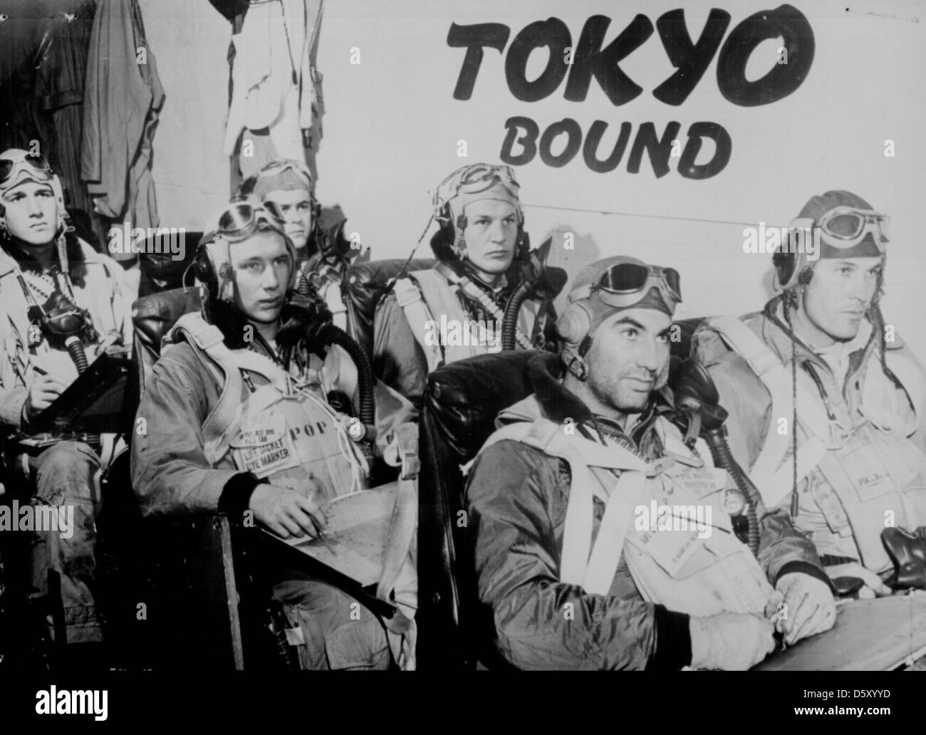 Military personnel attending a briefing in a squadron briefing room ...